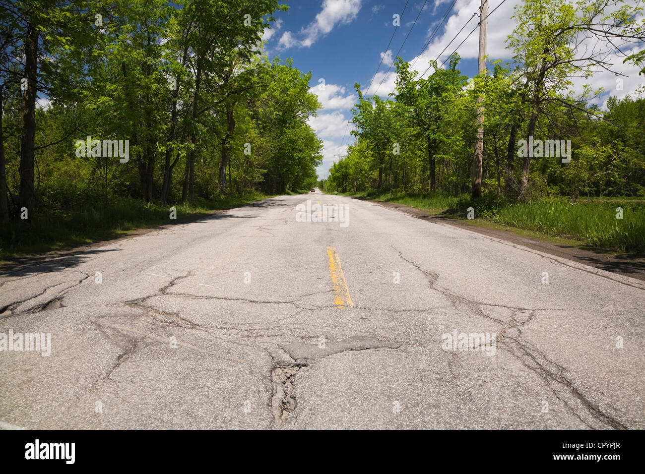 Damaged road in countryside hi-res stock photography and images - Alamy
