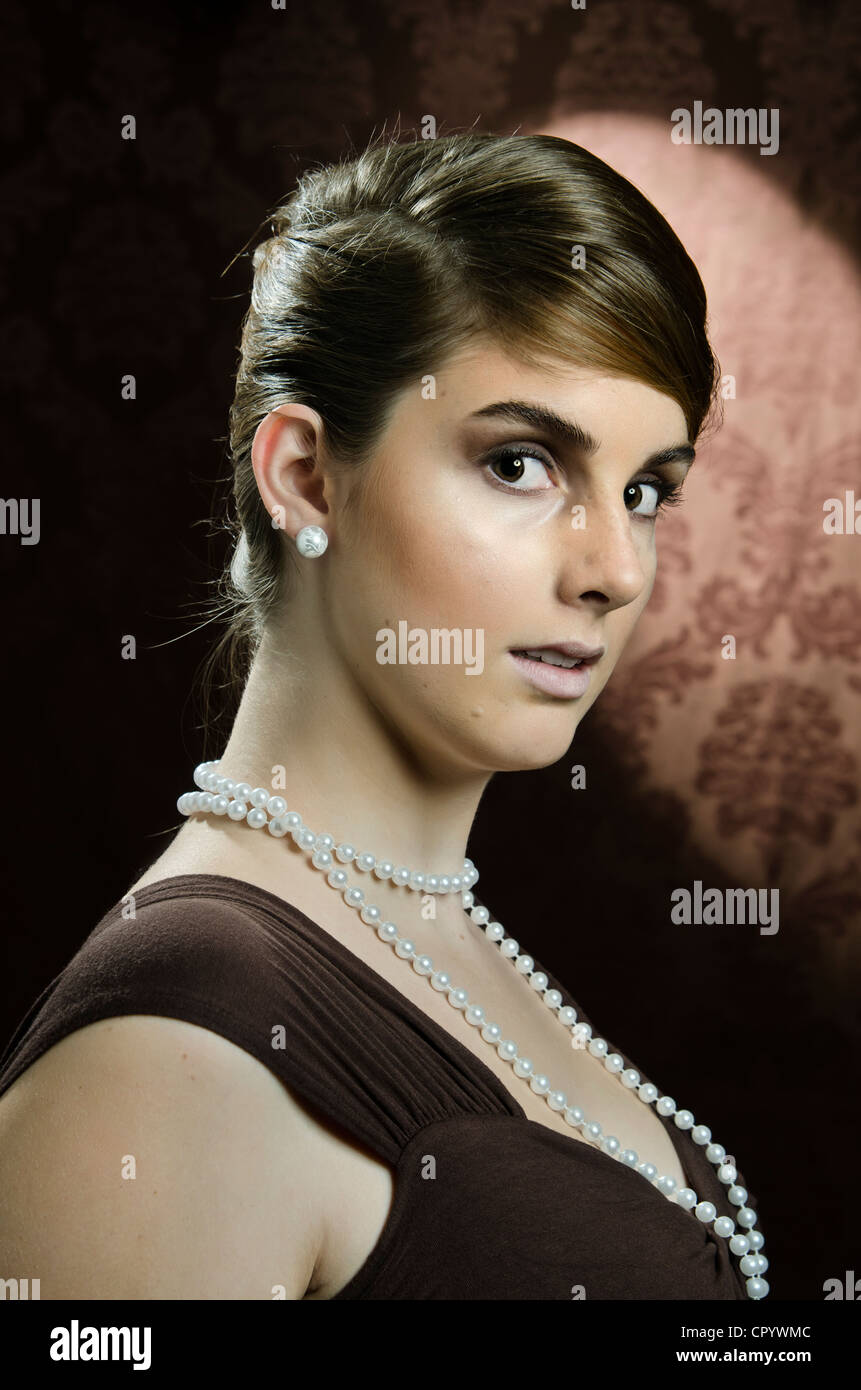 Young woman wearing a pearl necklace and pearl earrings, portrait Stock ...