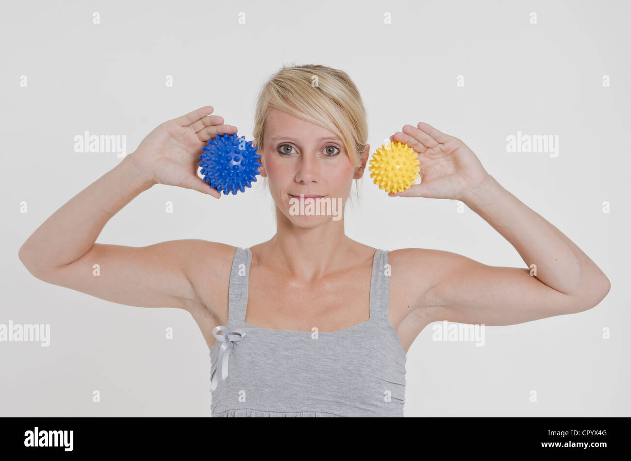 Young woman holding two spiky massage balls in her hands Stock Photo ...
