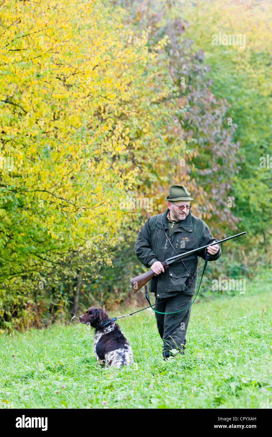 hunter with his dog hunting Stock Photo - Alamy