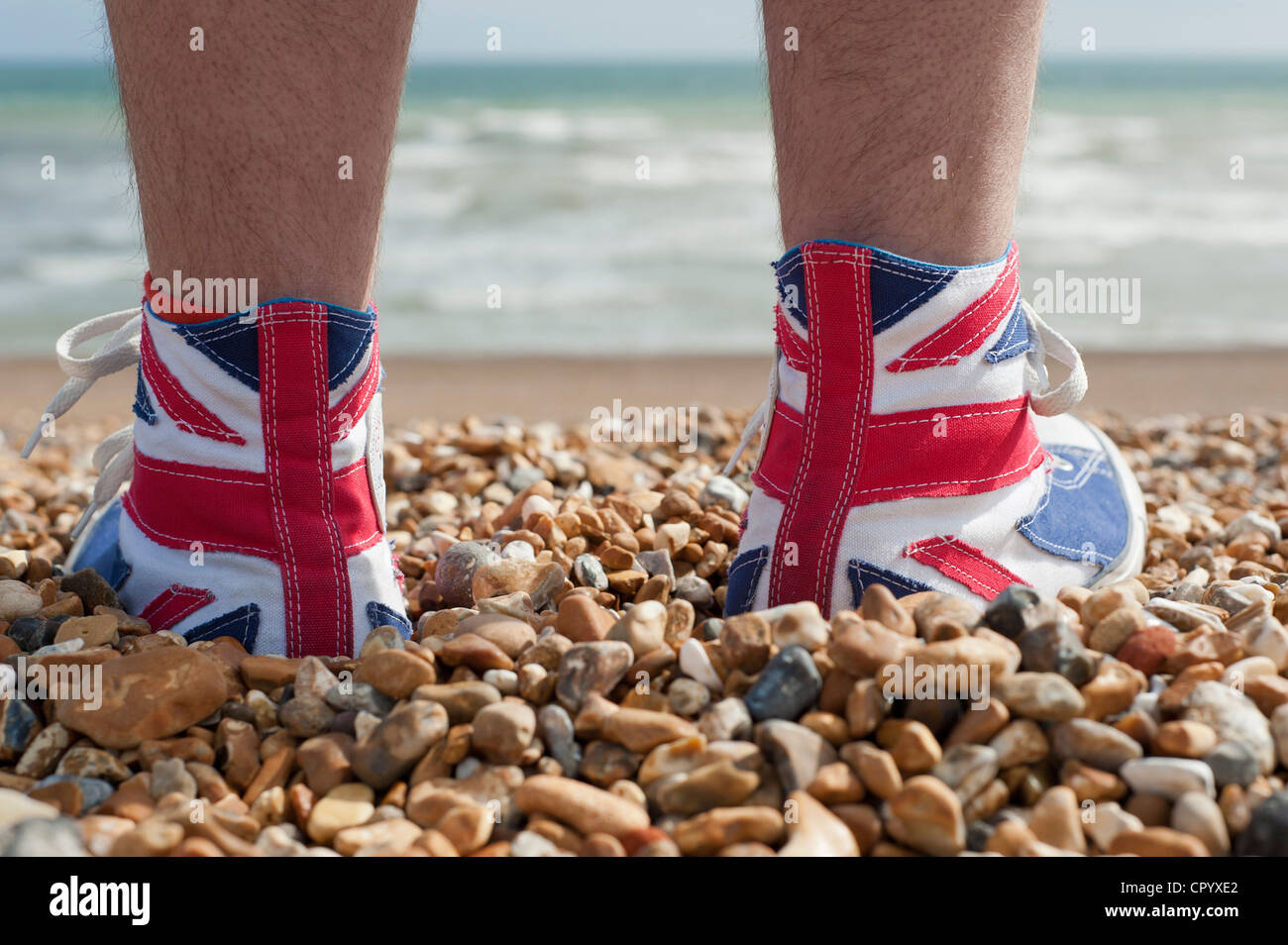 Pair of Union Jack Flag trainers on the beach Stock Photo - Alamy