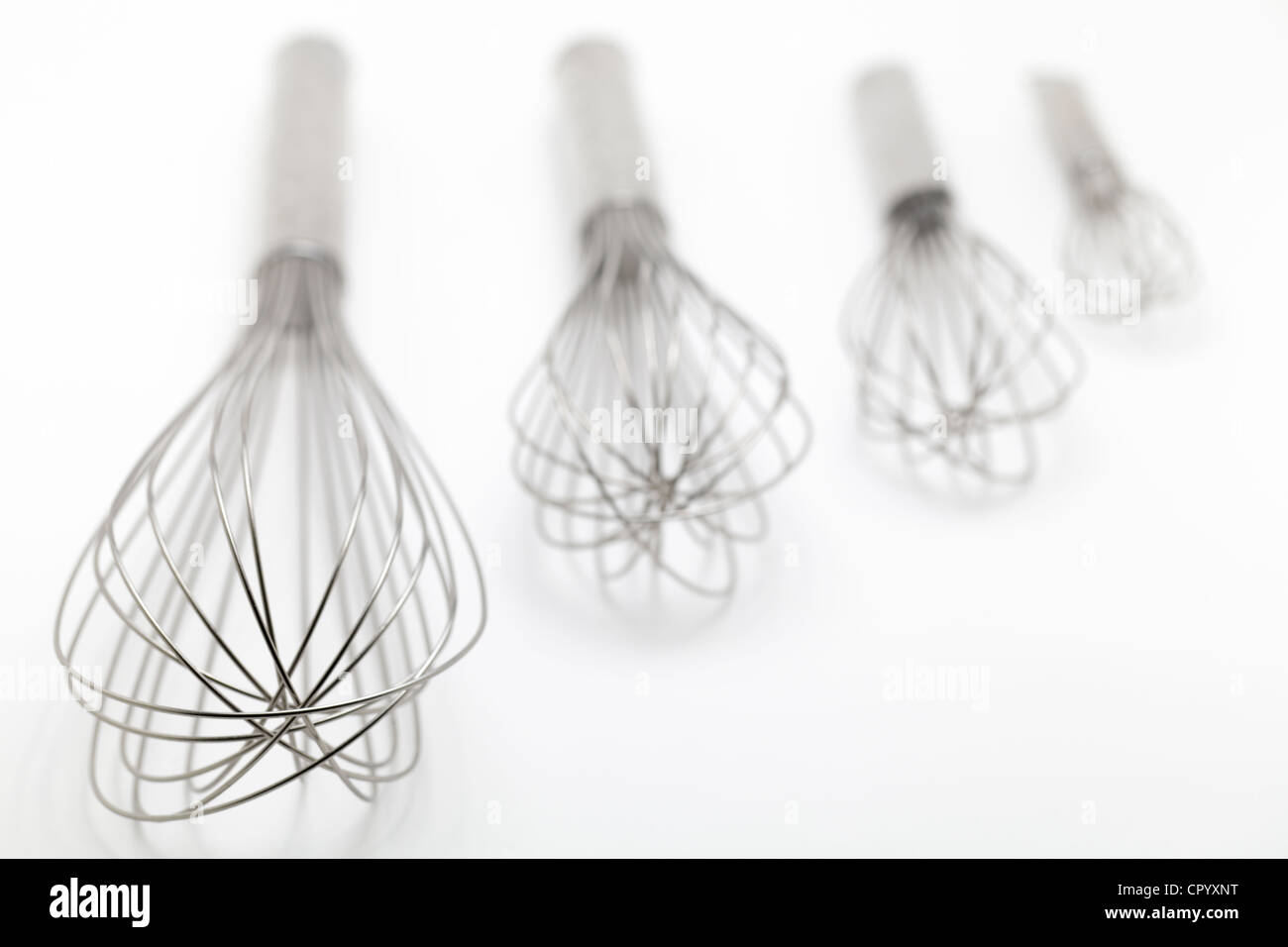 Different sized whisks Stock Photo - Alamy