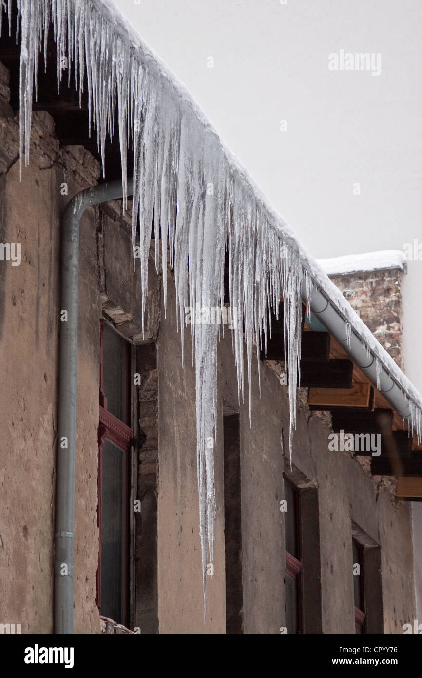 Long icicles on a building Stock Photo - Alamy