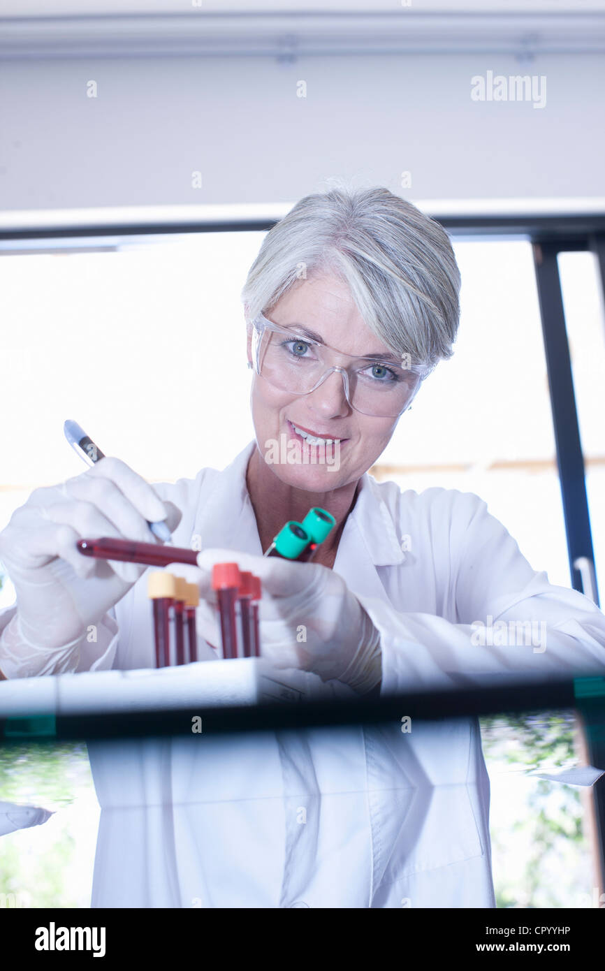 Scientist labeling test tube samples Stock Photo - Alamy