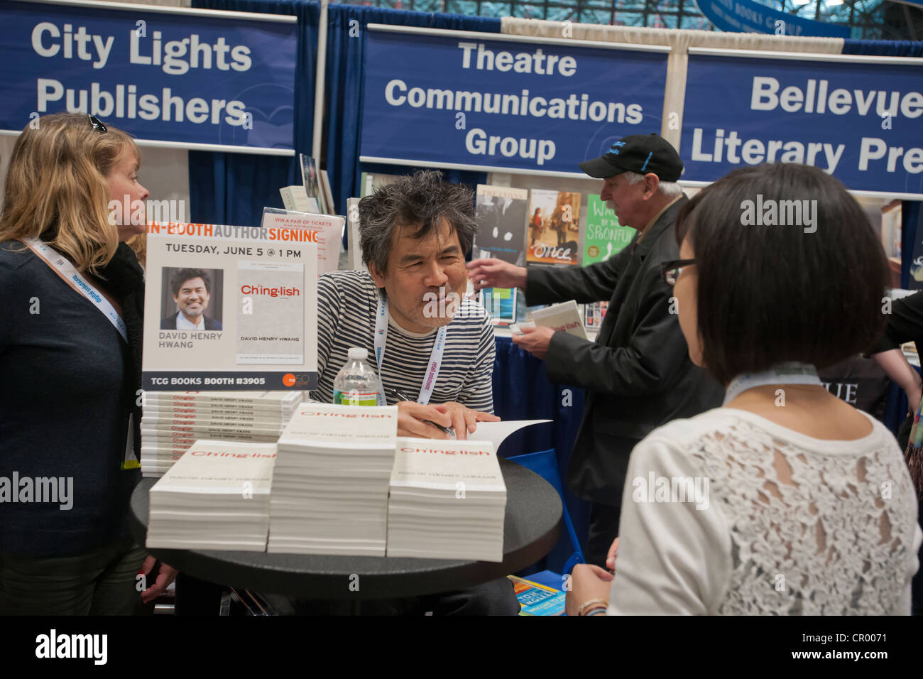 David Henry Hwang signs his book "Ching-lish" at the TCG Books booth at ...