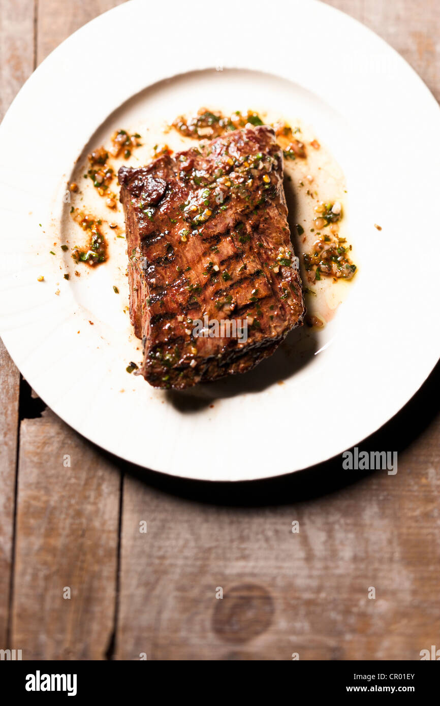Close up of plate of flank steak Stock Photo - Alamy