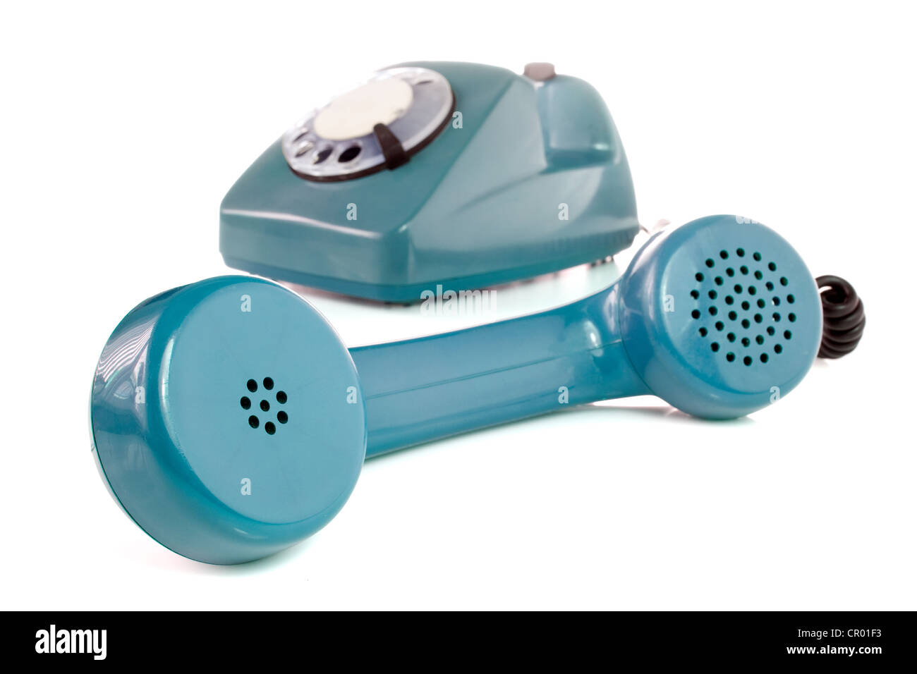 old blue telephone over a white background Stock Photo - Alamy
