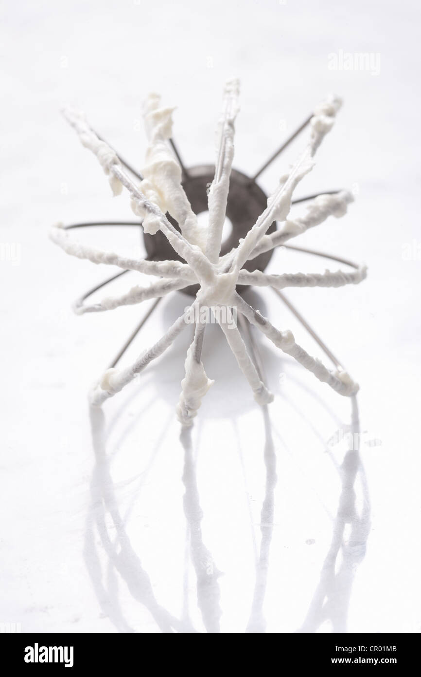 Close up of batter on mixing whisk Stock Photo - Alamy