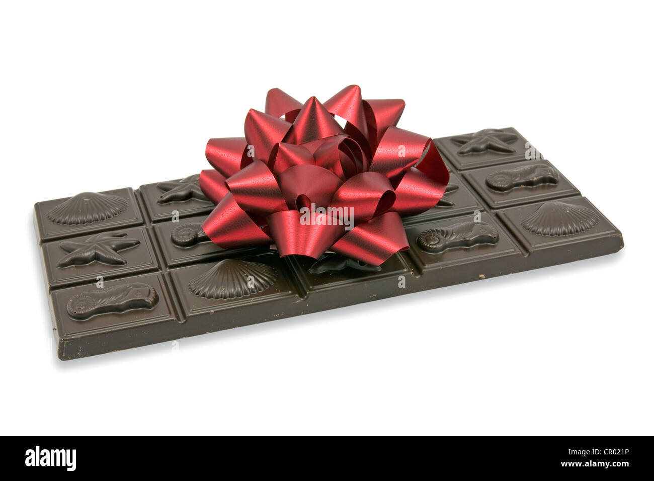 dark chocolate with red bow. isolated on white Stock Photo - Alamy