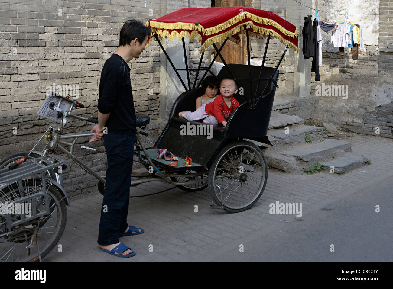 rickshaw children beijing china Stock Photo - Alamy