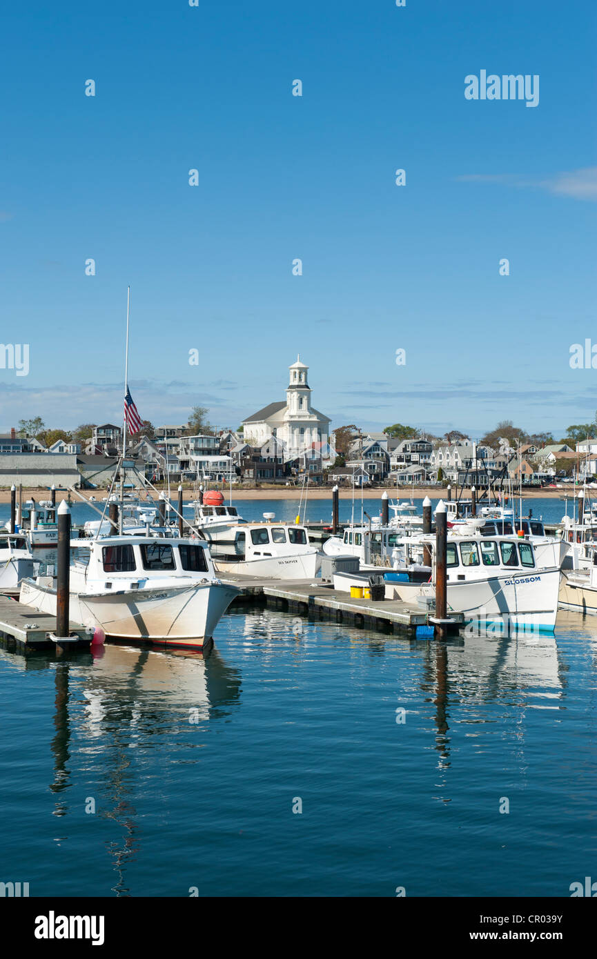 View from the pier towards boats and the city, Provincetown, Cape Cod ...