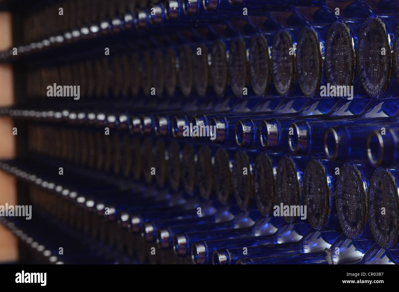 A stack of blue sherry bottles Stock Photo - Alamy