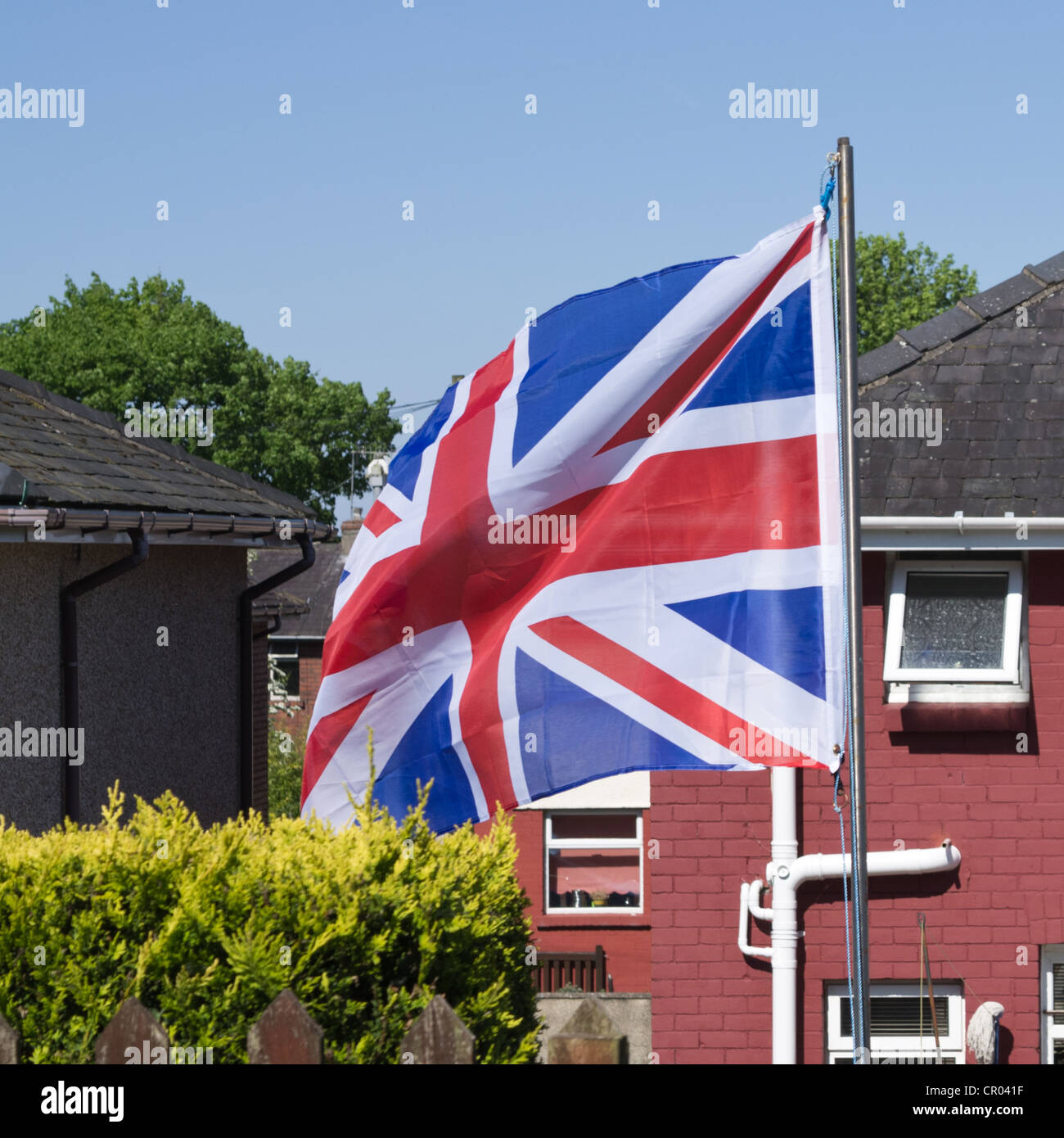 A Union Flag flying at the bottom of a garden Stock Photo - Alamy