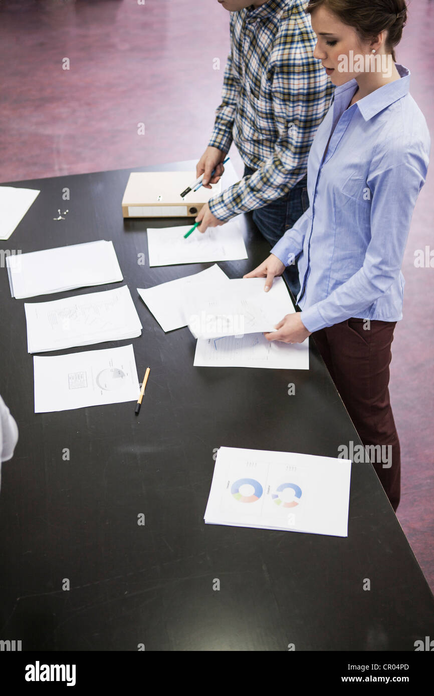 Business people organizing papers Stock Photo - Alamy