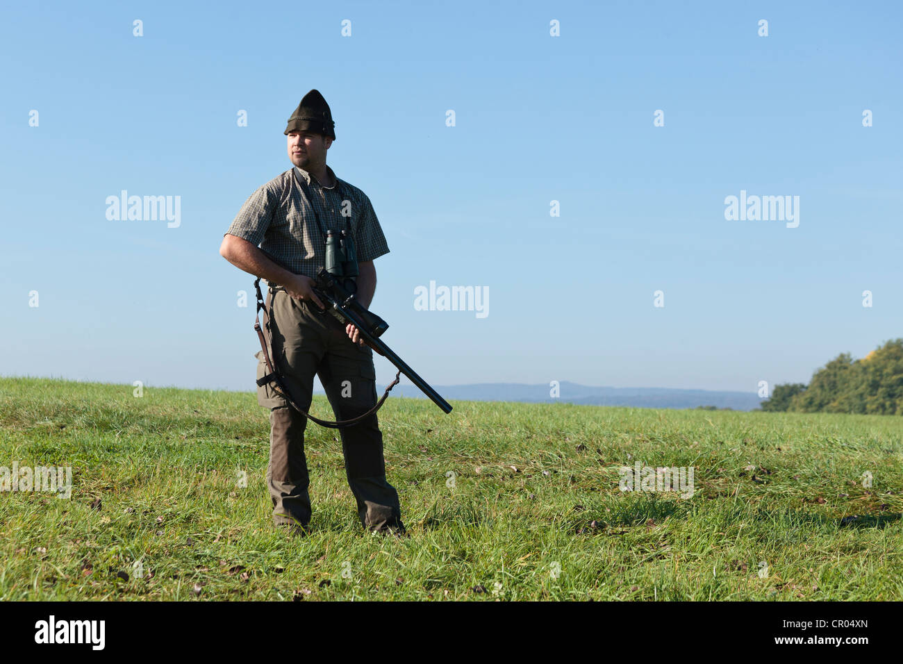 Hunter waiting for game Stock Photo - Alamy