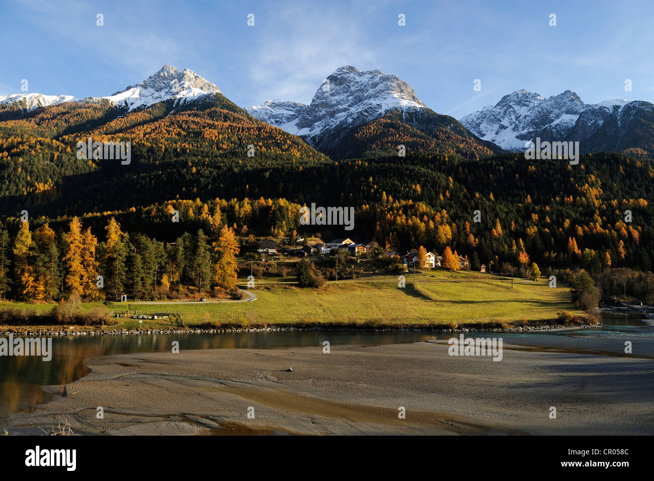 Inn River surrounded by autumn-coloured larch forests and mountains ...