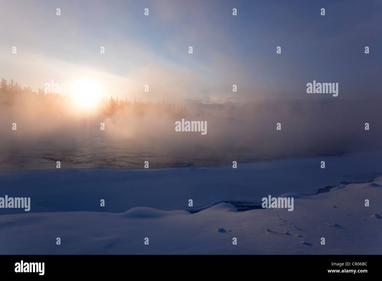 Ice fog, steam, mist over partly frozen Yukon River, Whitehorse, Yukon ...