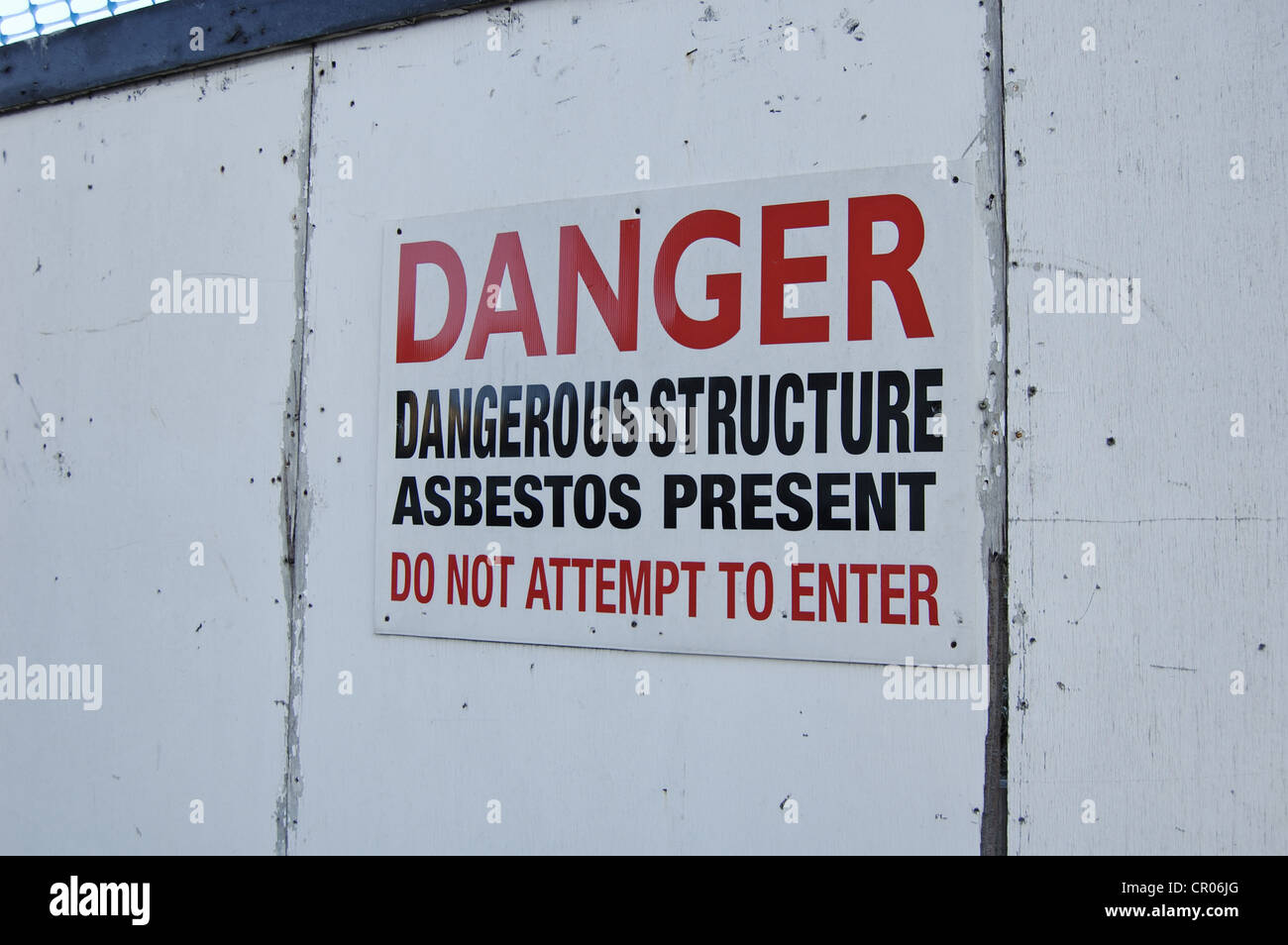 Asbestos warning sign at demolition site in the docklands, London ...