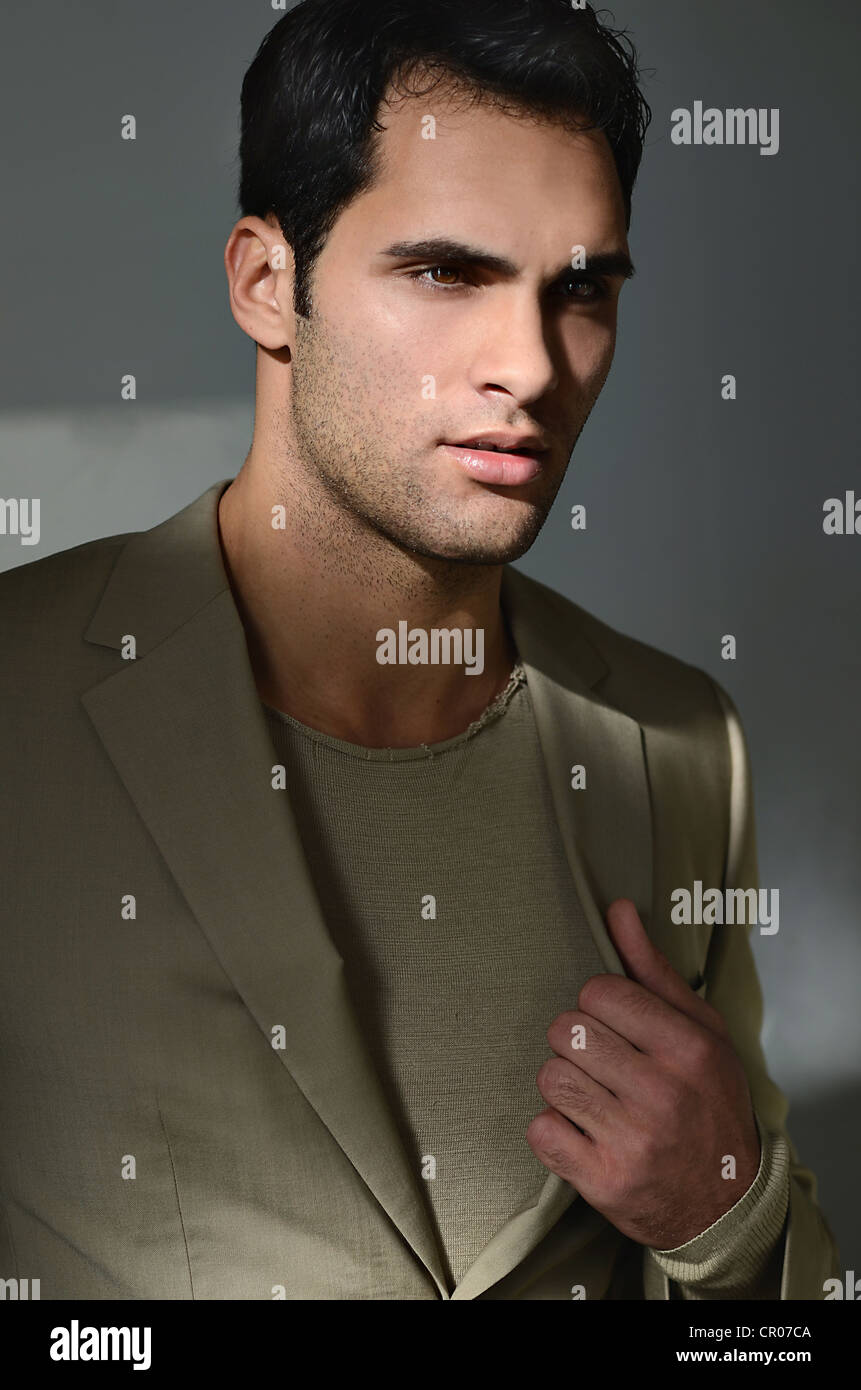 Young man lit by sunlight, portrait Stock Photo - Alamy