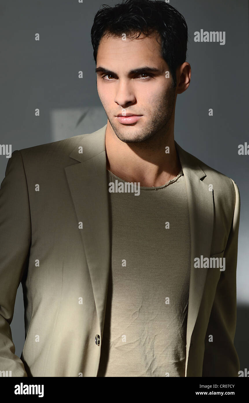 Young man lit by sunlight, portrait Stock Photo - Alamy
