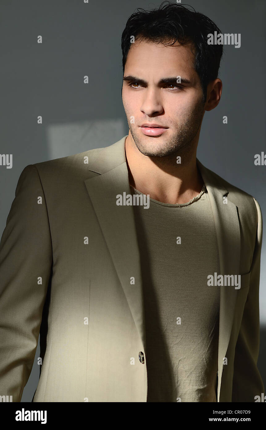 Young man lit by sunlight, portrait Stock Photo - Alamy