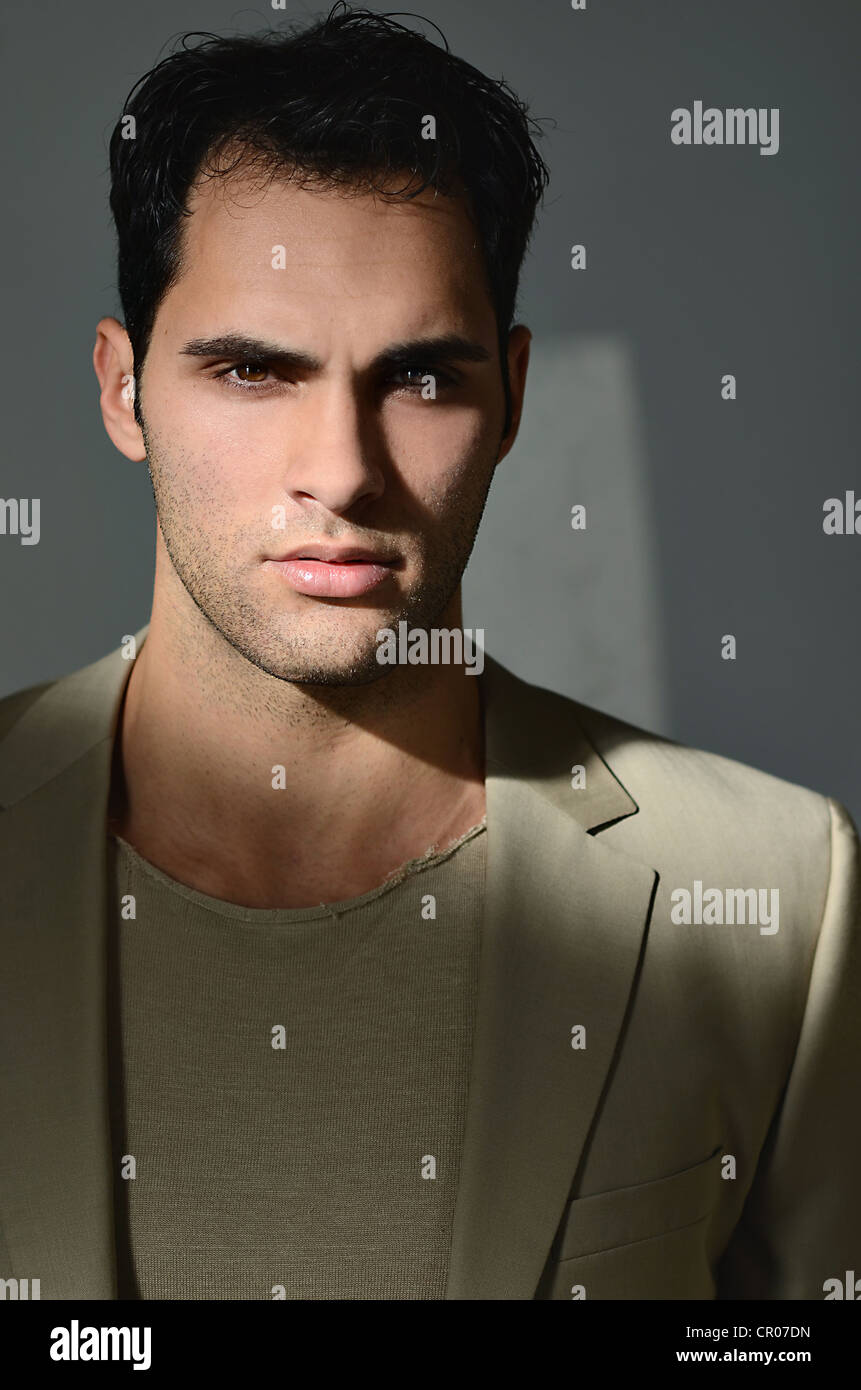 Young man lit by sunlight, portrait Stock Photo - Alamy