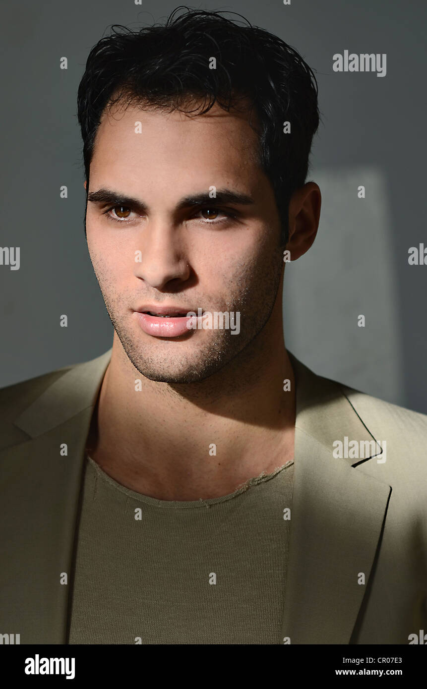 Young man lit by sunlight, portrait Stock Photo - Alamy