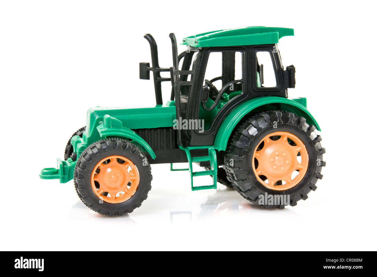 green plastic tractor over a white background Stock Photo - Alamy