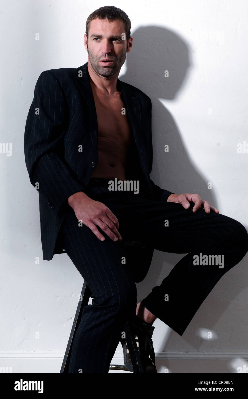 Man sitting without a shirt hi-res stock photography and images - Alamy