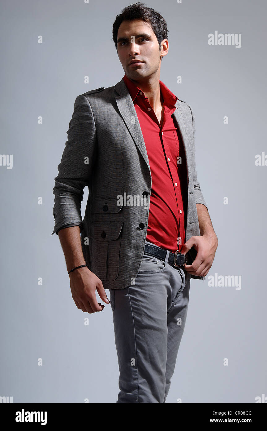 Young mediterranean-looking man wearing a suit Stock Photo - Alamy