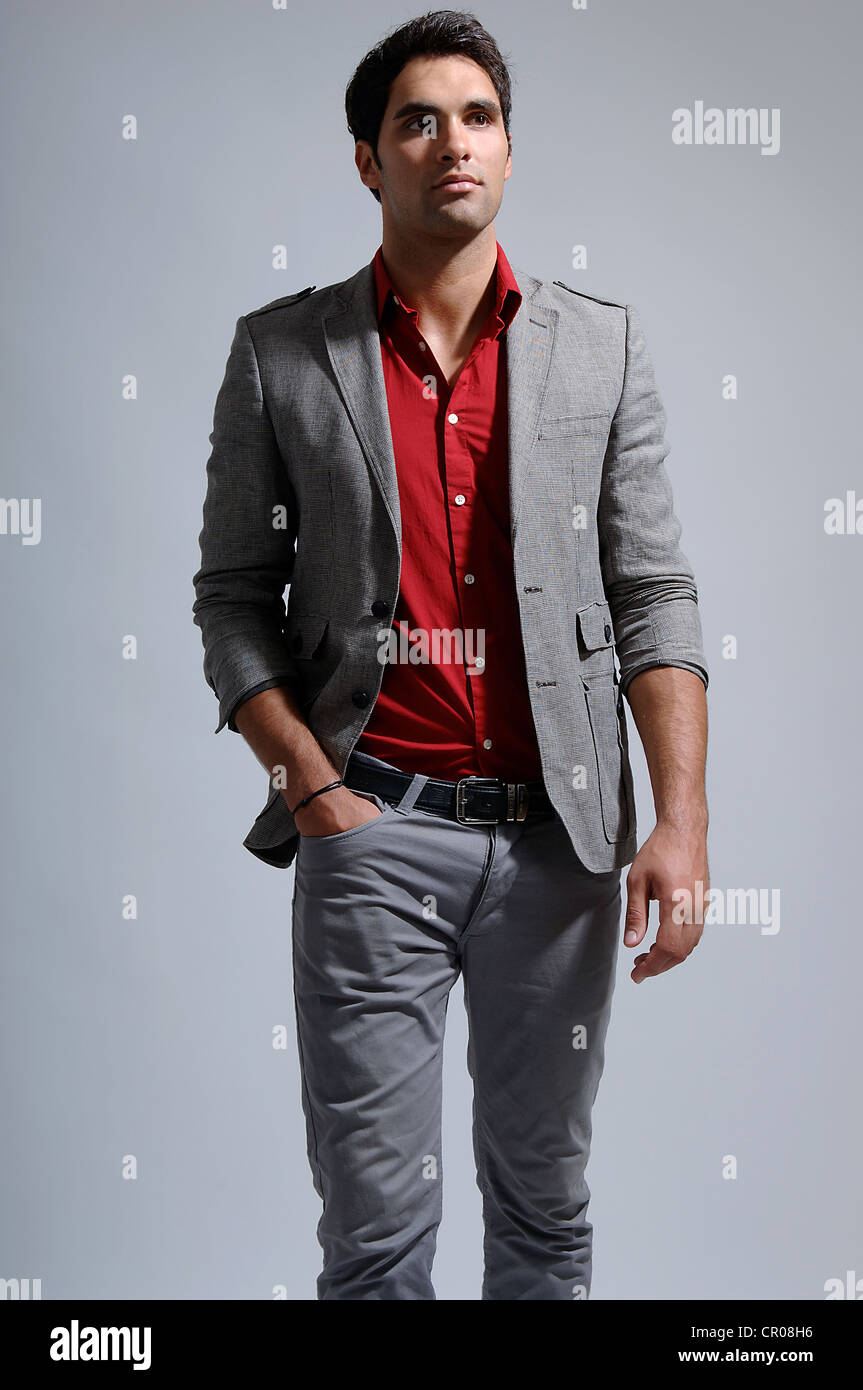 Young mediterranean-looking man wearing a suit Stock Photo - Alamy