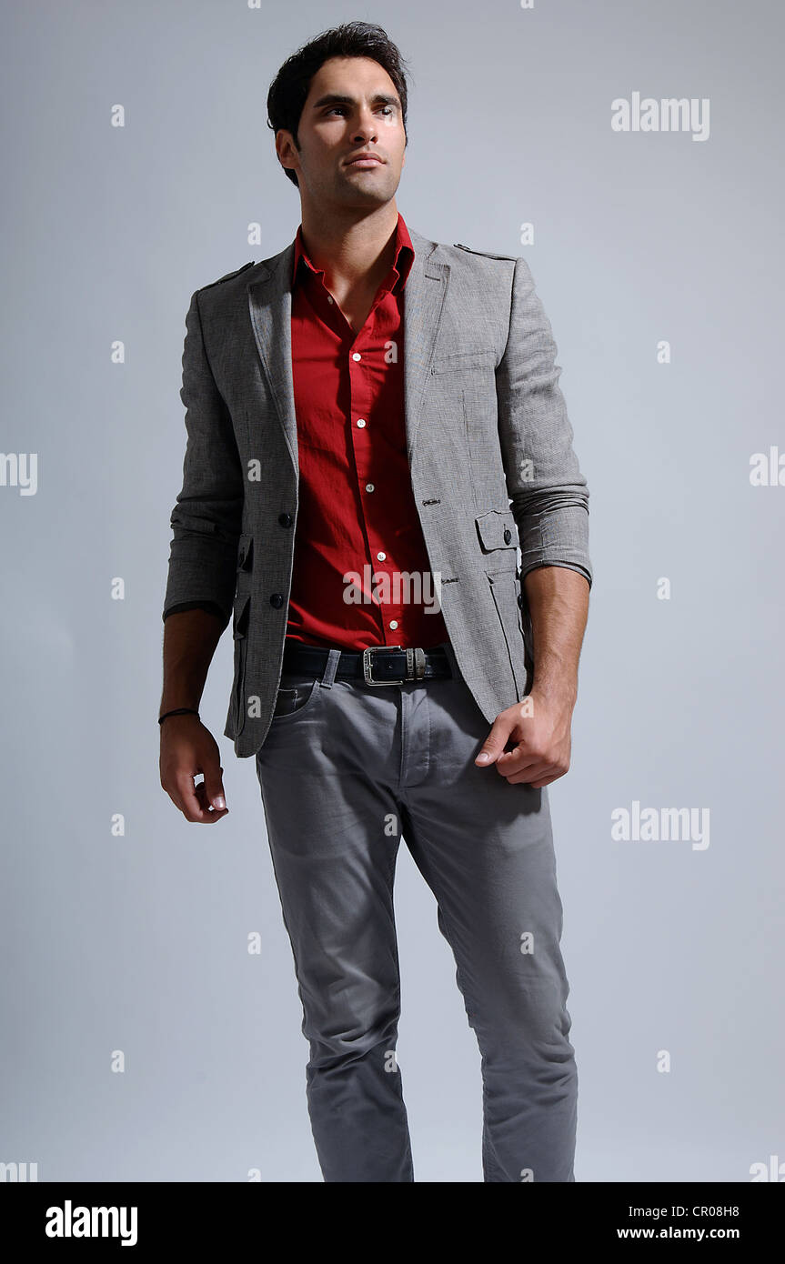 Young mediterranean-looking man wearing a suit Stock Photo - Alamy