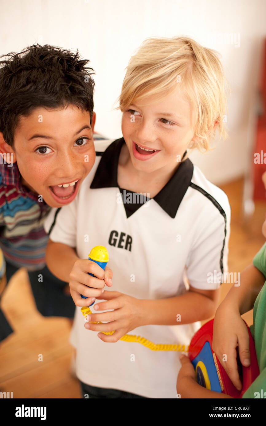Boys playing together indoors Stock Photo - Alamy