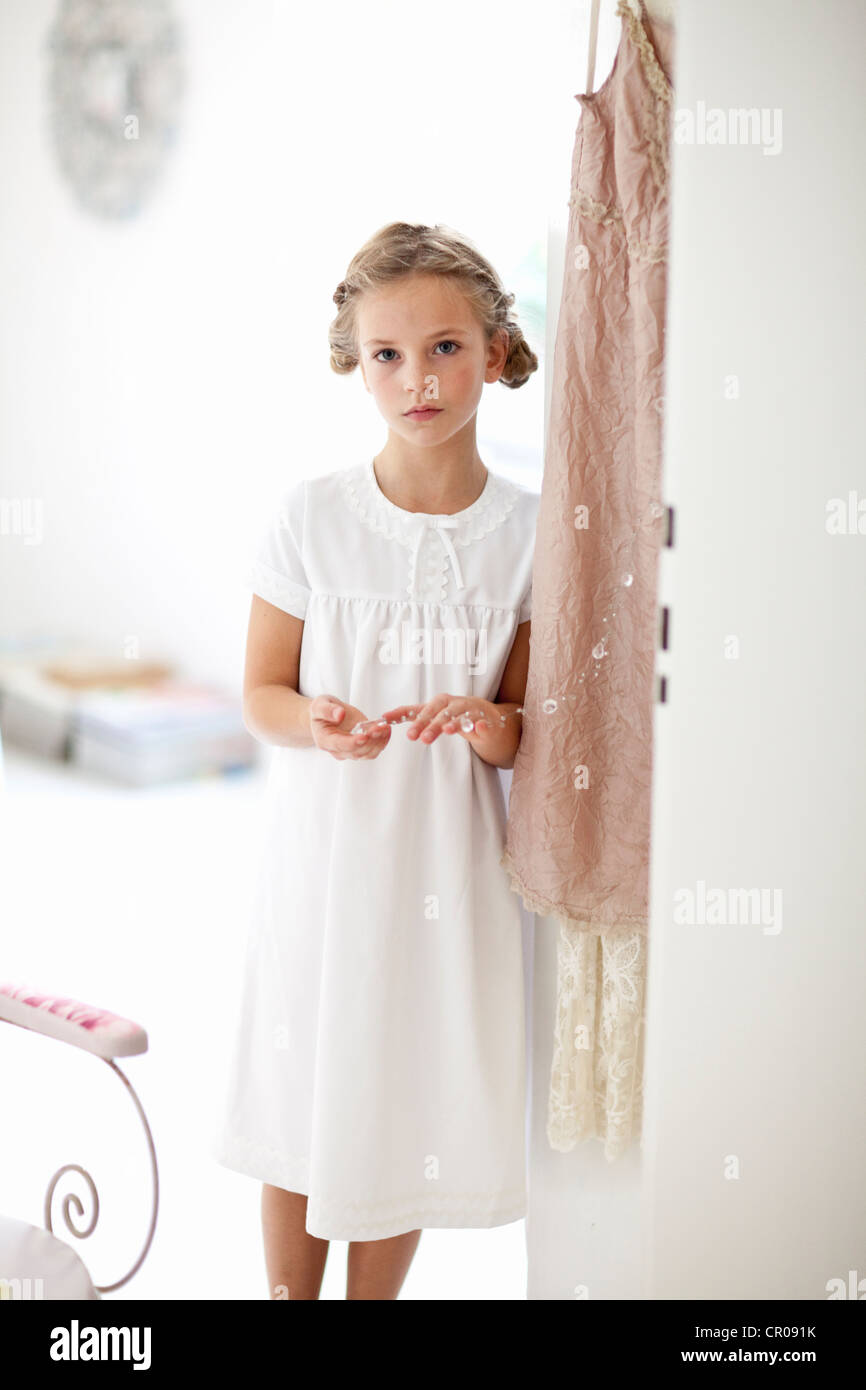 Girl walking in hallway Stock Photo - Alamy