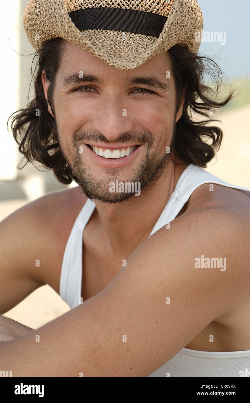 Dark haired man on the beach hi-res stock photography and images - Alamy