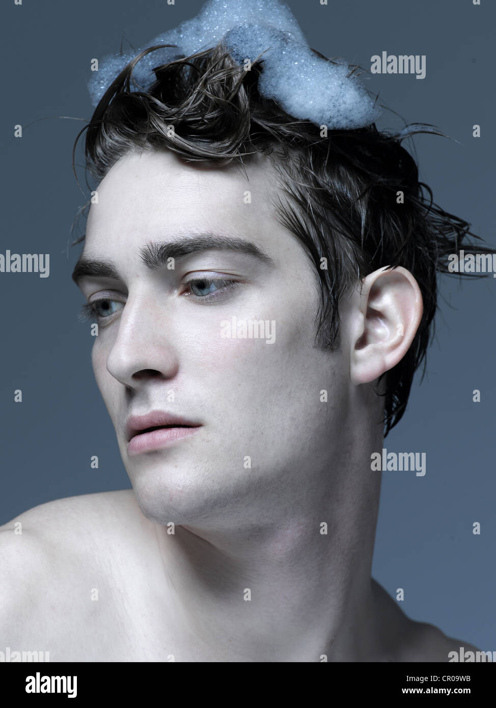 Beauty portrait of a young man washing his hair Stock Photo - Alamy