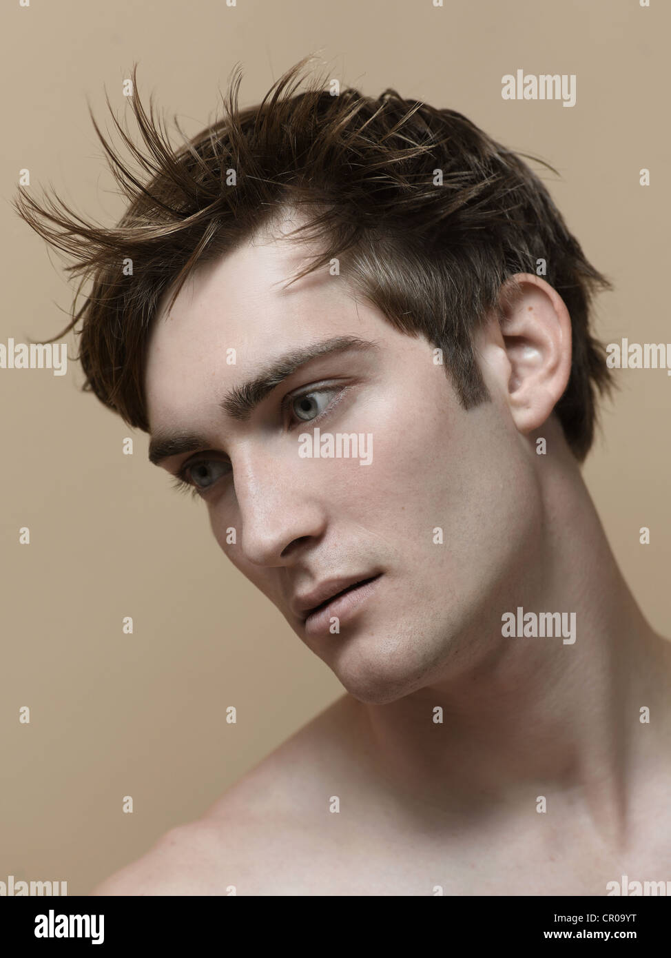Beauty portrait of a young man with moving hair Stock Photo - Alamy