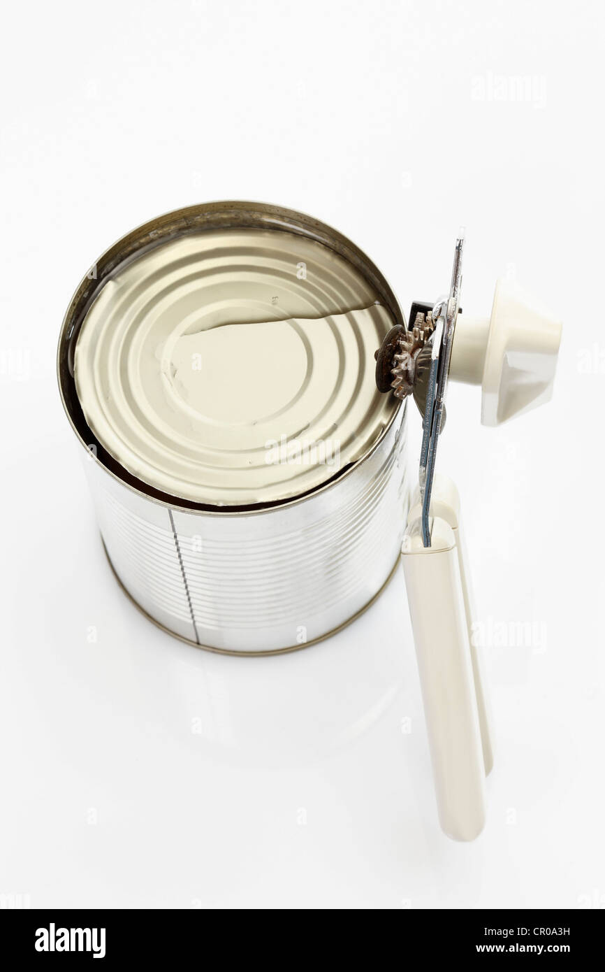 Tin with tin opener Stock Photo - Alamy