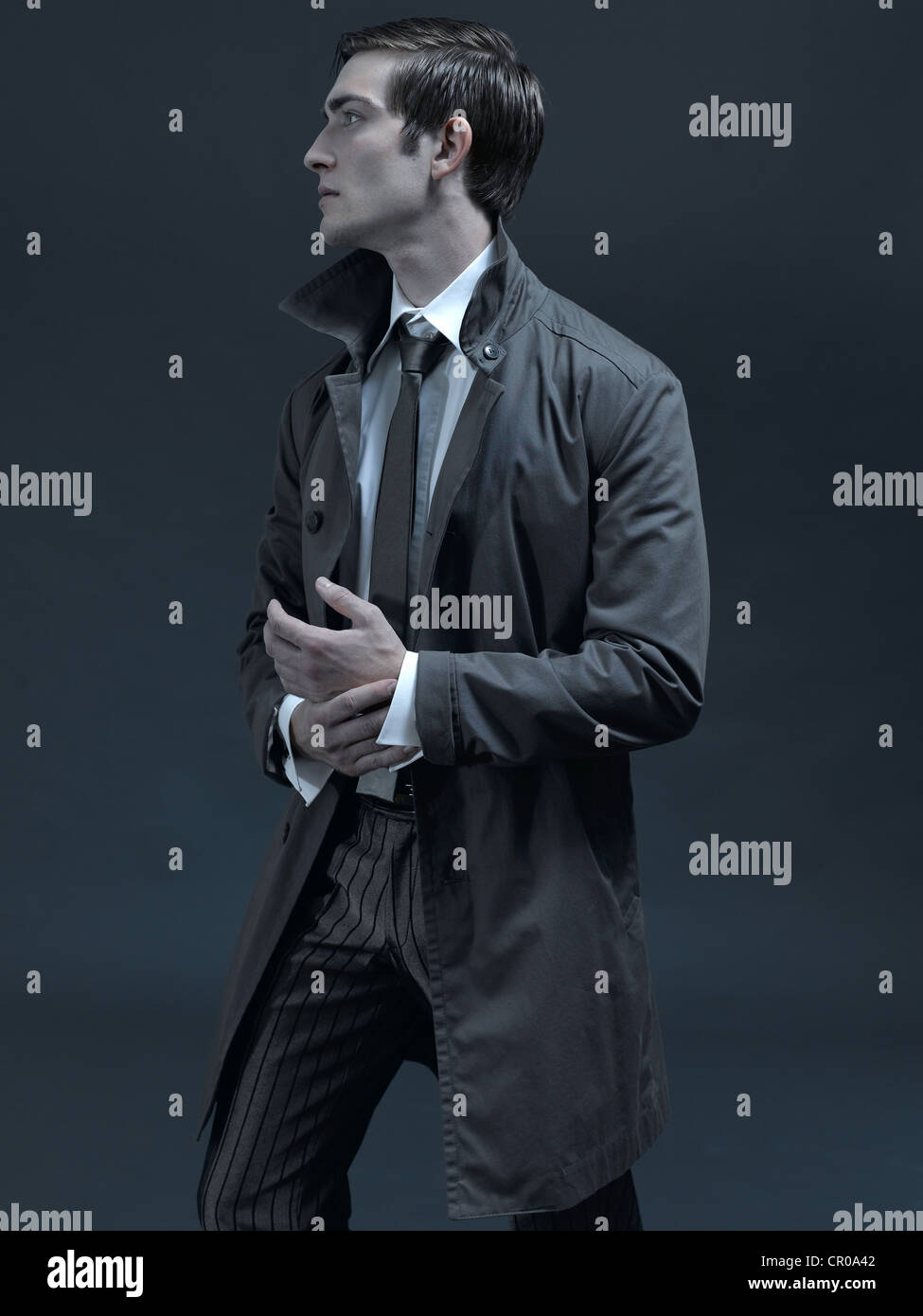 Fashion shot of a man in a suit and jacket Stock Photo - Alamy