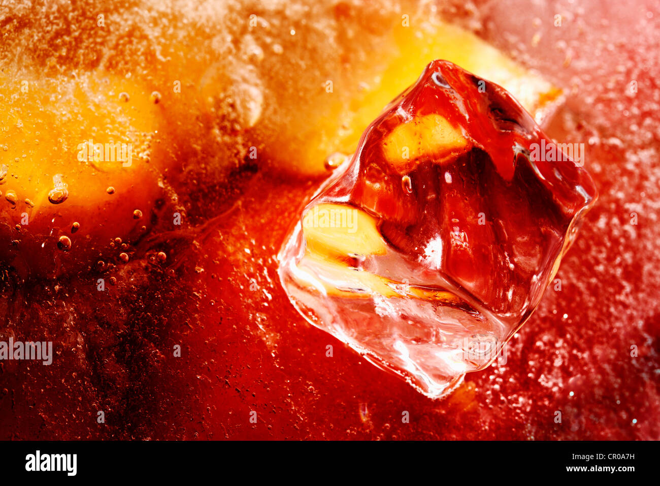 Ice cube on a block of ice with frozen peaches Stock Photo - Alamy