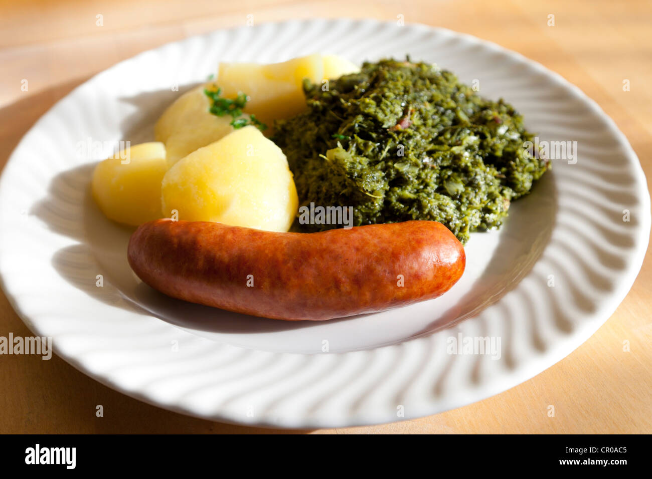 German Mettwurst sausage with kale and boiled potatoes Stock Photo - Alamy