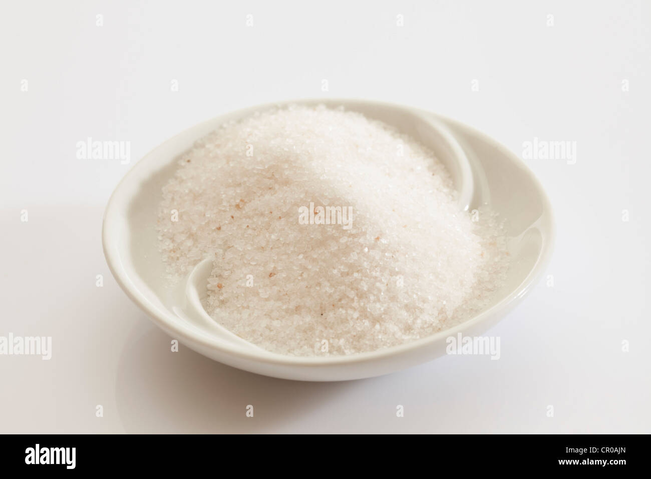 Himalayan rock salt in a small porcelain bowl Stock Photo - Alamy