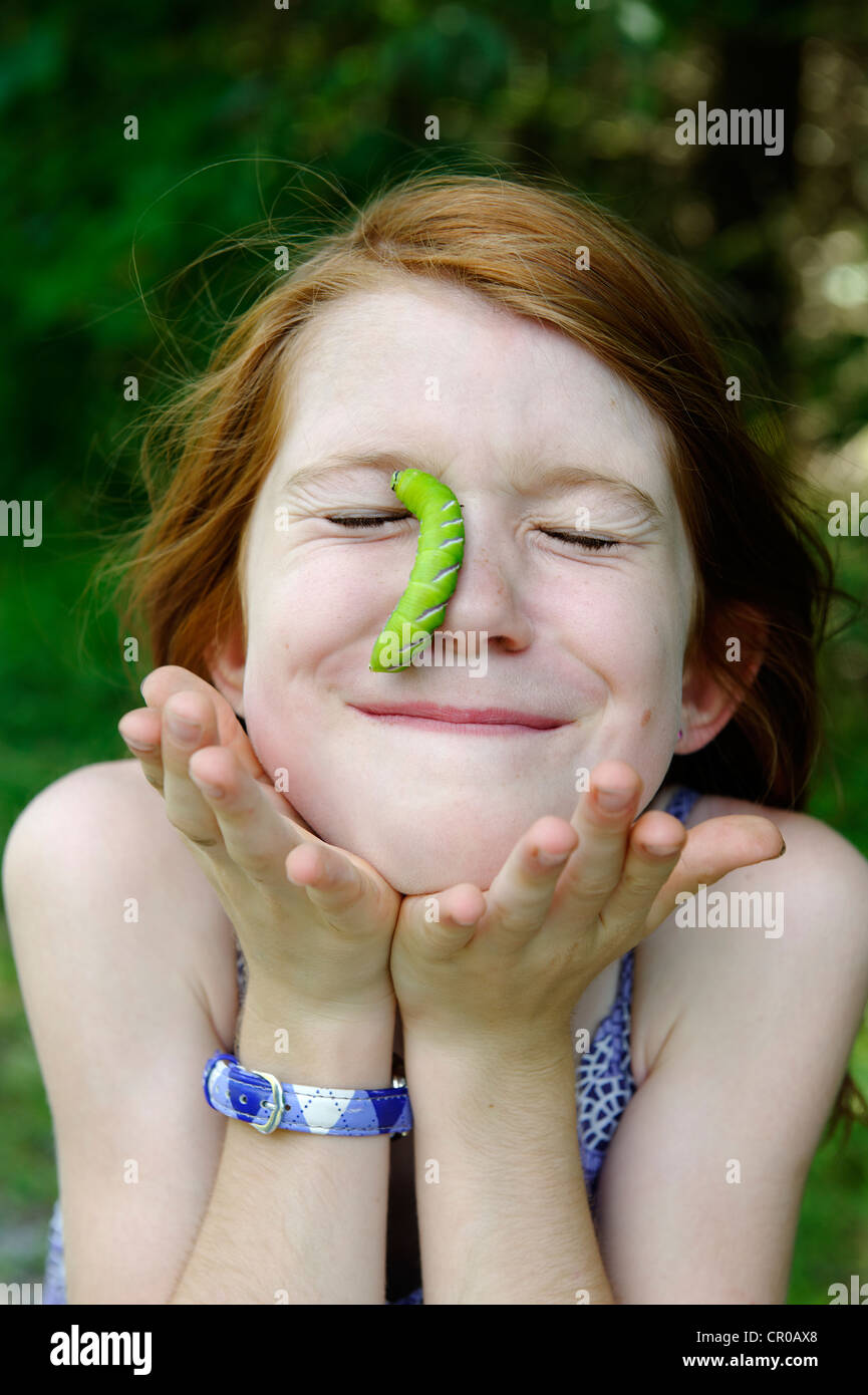 Girl with caterpillars hi-res stock photography and images - Alamy