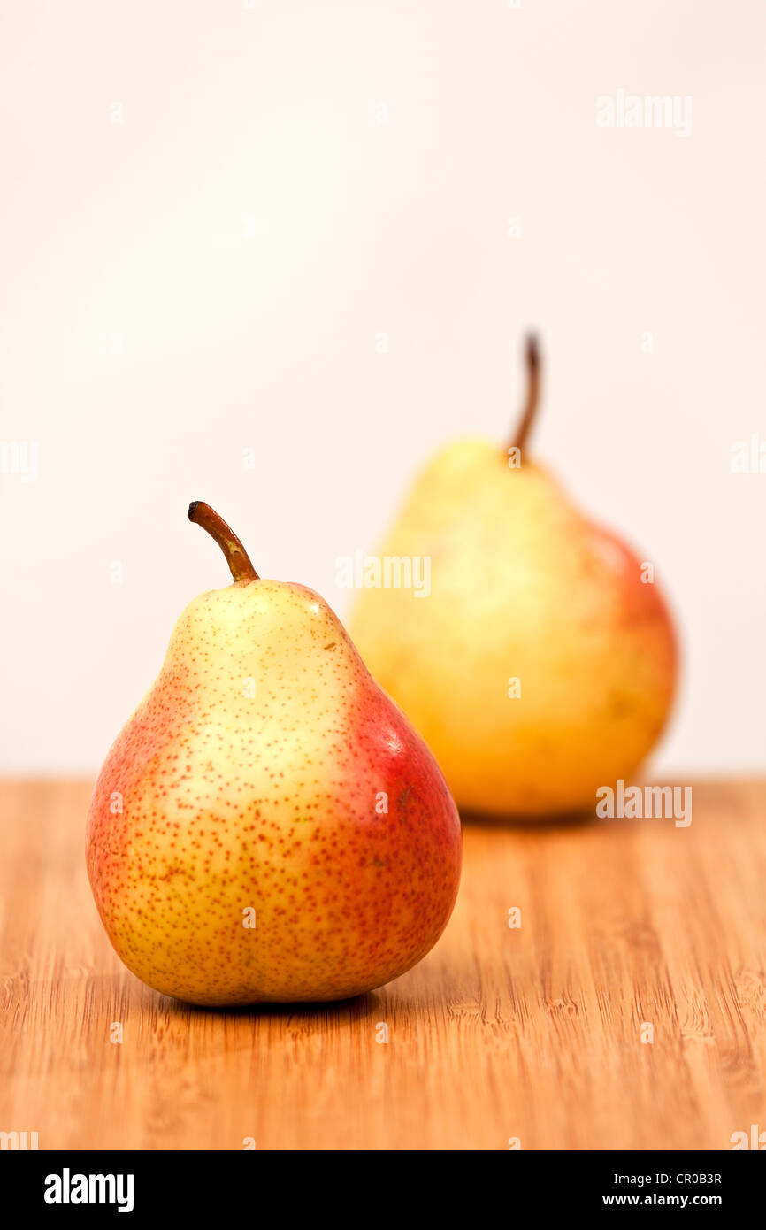 Two pears on a cutting board Stock Photo - Alamy