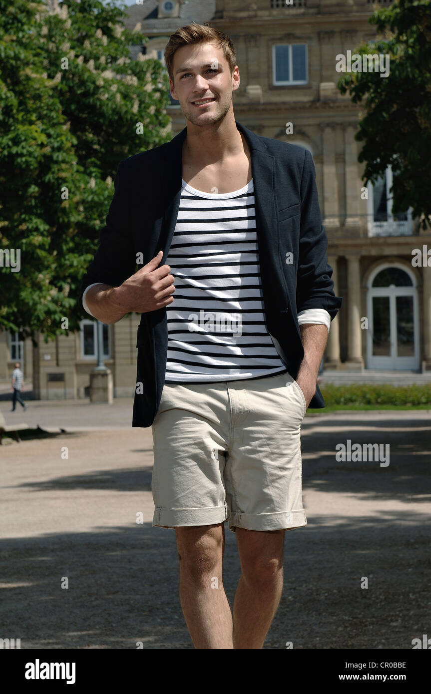 Man in shorts in the city Stock Photo - Alamy