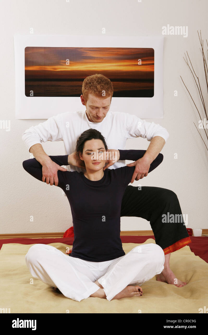 QiGong coach doing relaxation exercises with a young woman, Chinese ...