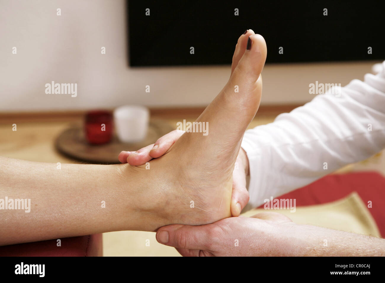 Traditional Thai foot massage Stock Photo - Alamy