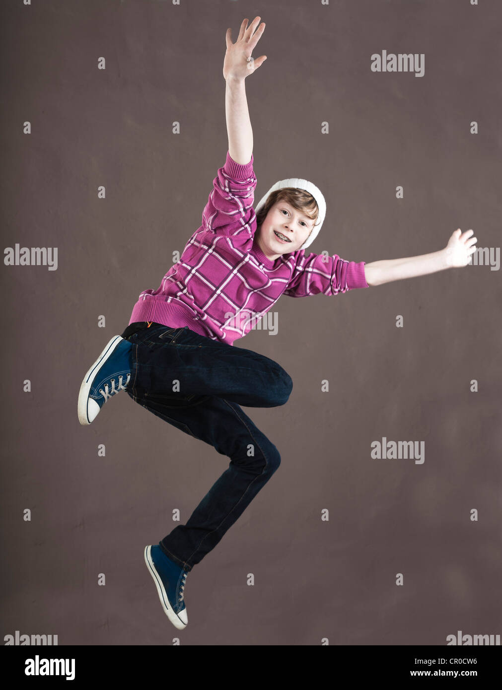 Boy leaping into the air Stock Photo - Alamy