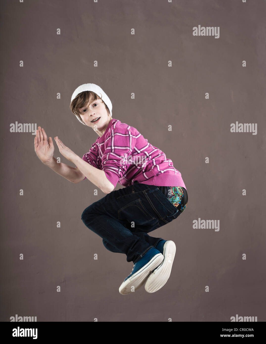 Boy leaping into the air Stock Photo - Alamy