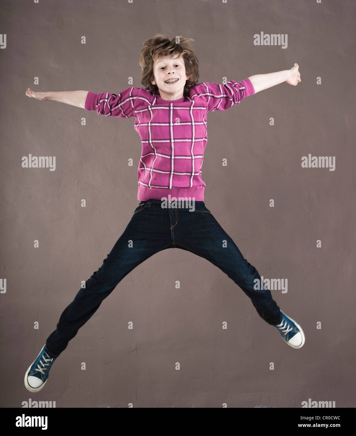 Boy leaping into the air Stock Photo - Alamy